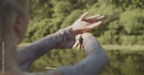Unrecognized Model Puts Her Hands Up In The Air And Moves Her Fingers