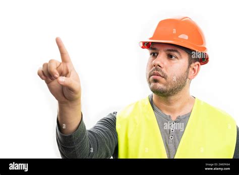 Male Constructor Wearing Safety Helmet And Fluorescent Vest With