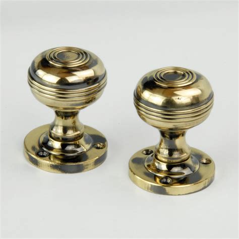 Regency Bloxwich Solid Antique Brass Door Knobs Handles On A Round Ros