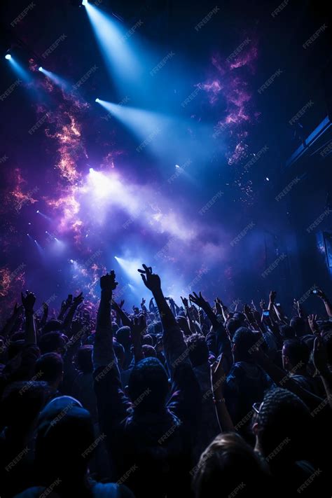 Premium Photo Stage Lighting Shining Down From The Top Many People Holding Their Mobile Phone