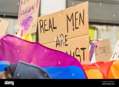 Gay Young Adult With Lgbtq Flag And Supporting A Feminist Message