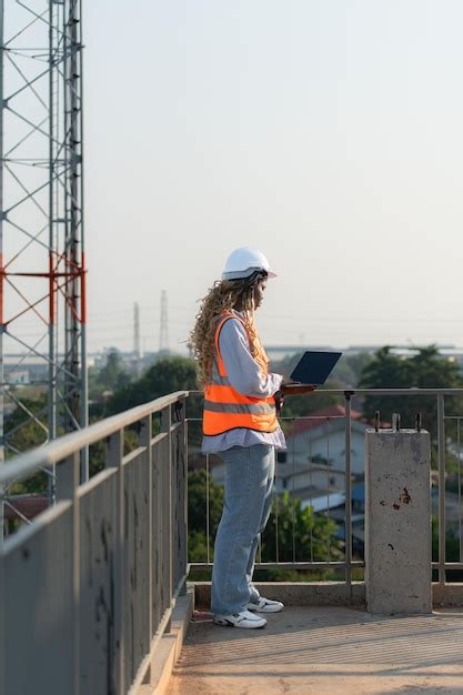 Premium Photo Engineer Working On A Building Site The Telephone And