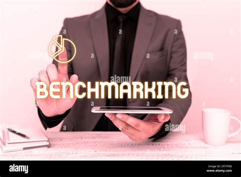 Sign Displaying Benchmarking Word Written On Evaluate Something By