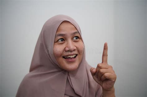 Asian Muslim Woman Thinking Something With Smile On Her Face Happy