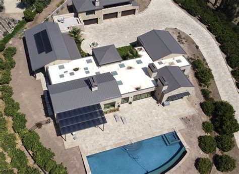 Kilowatt Solar System Rooftop Panels Installed On Metal Standing Seam Roof And Semi