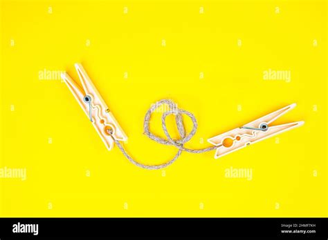 The Connection With A String Between Two Clothespins Stock Photo Alamy