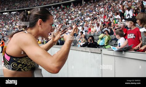 Russian Pole Vaulter Yelena Isinbayeva Waves To The Spectators During
