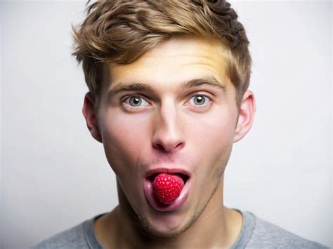A Young Man Blowing A Raspberry With Her Tongue Out Premium Ai