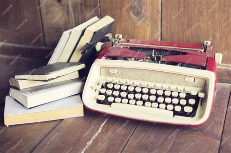 Premium Photo Old Style Typewriter With Books On Wooden Floor