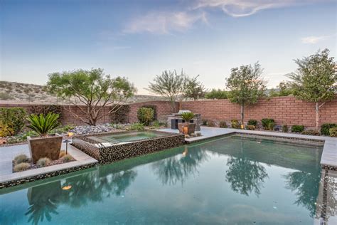 Lap Pool With Rim Flow Spa And Fire Pit Tropical Swimming Pool And Hot Tub Las Vegas By