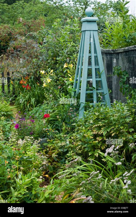 wooden garden obelisk Stock Photo - Alamy