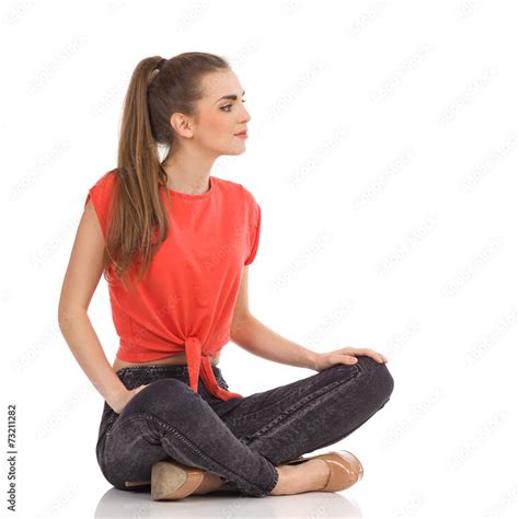 Girl Sitting On The Floor With Legs Crossed Stock Photo Adobe Stock