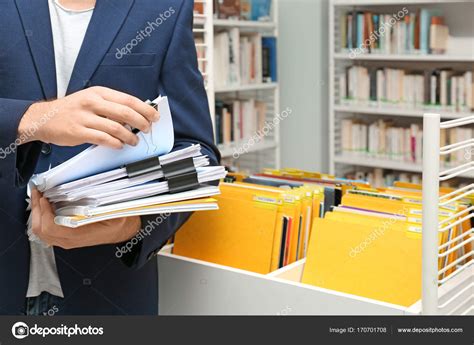Man Searching For Documents In Archive Stock Photo Belchonock
