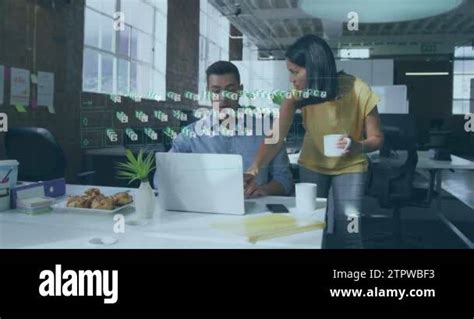 animation of illuminating pattern on keyboard numbers over diverse coworkers discussing in