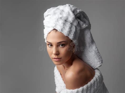 Attractive Girl Wearing White Towel On Head And White Bath Robe