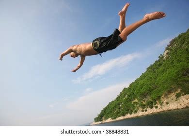 Man Doing Back Somersault Against Blue Stock Photo 2291233175