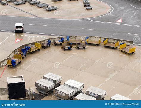 Empty Luggage Trolleys And Uld Air Cargo Containers Editorial Photo