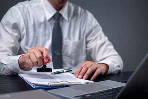 Business Professional Stamping A Document For Approval Perfect For