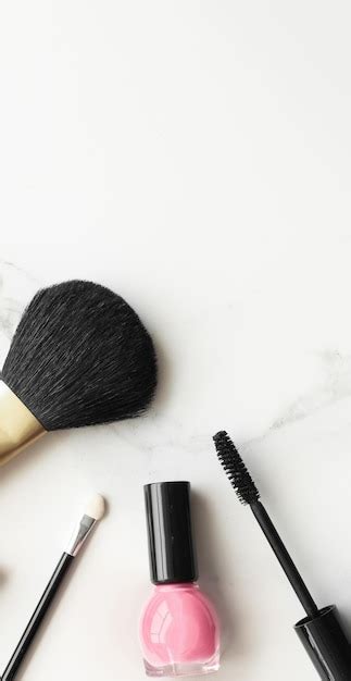 Premium Photo Makeup And Cosmetics Products On Marble Flatlay Background