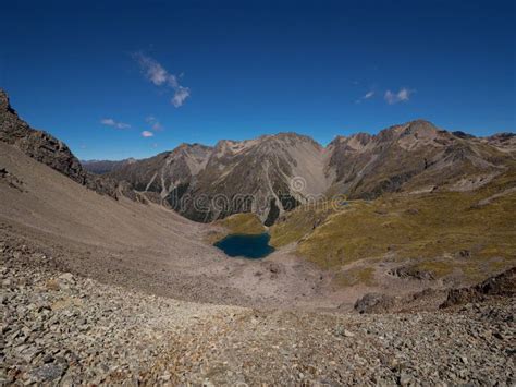 Southern Alps Mountain Panorama Of Scenic Alpine Tarn Lake In Nelson