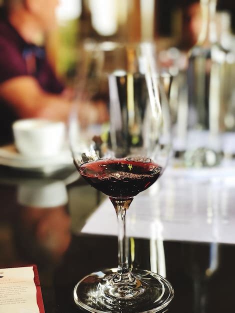 Premium Photo Close Up Of Wine Glass On Table In Restaurant