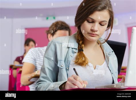 Babe Girl Writing Test In Classroom Stock Photo Alamy