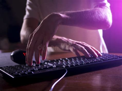 Close Up Gamer Hands On The Keyboard Playing Video Games In Night Stock