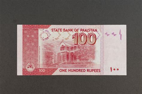 Pakistani 100 Rupee Red Color Banknote Reverse Side Showing Ziarat