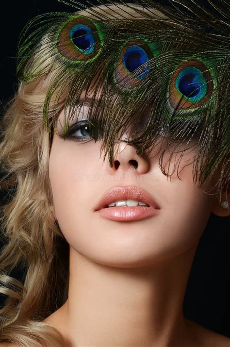 The Beautiful Woman With Feathers Of A Peacock Stock Image Image Of Feather Cosmetics