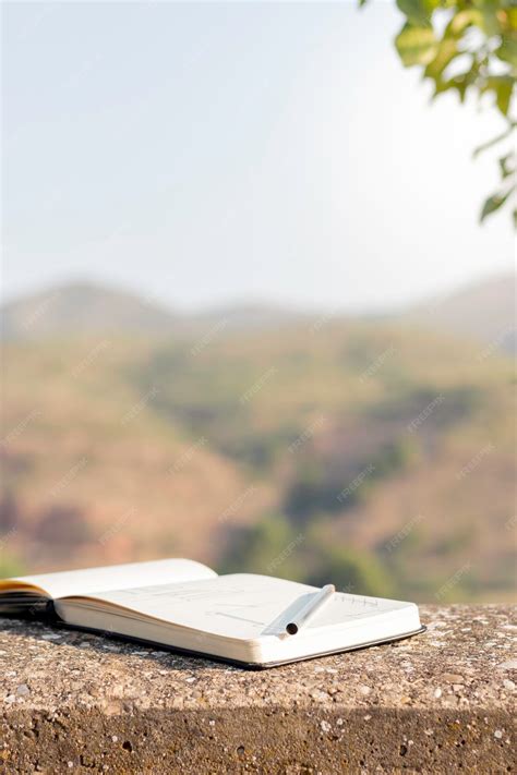 Premium Photo Vertical View Of Isolated Open Notebook With A Pen On