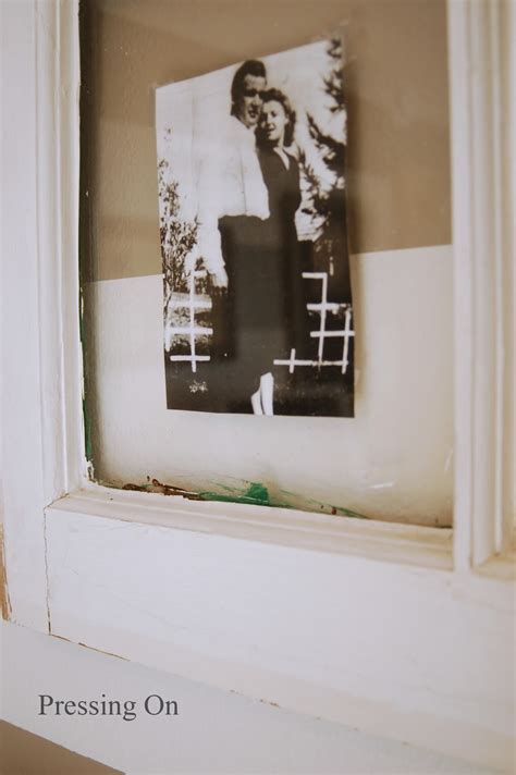 Pressing On Old Photos In A Window