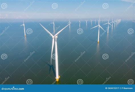 Windmill Turbines At Sea Seen From A Drone Aerial View From Above At A