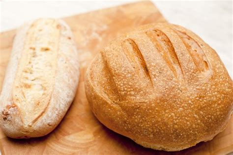 Two Fresh Crusty Loaves Of Bread Premium Ai Generated Image