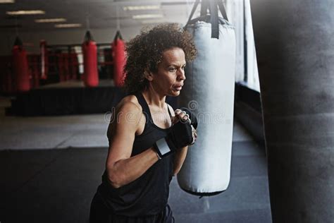 Gym Punching Bag And Mature Woman In Boxing For Workout Challenge Or