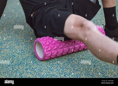 Fitness Trainer Exercises And Warms Up The Lower Part Of The Body With