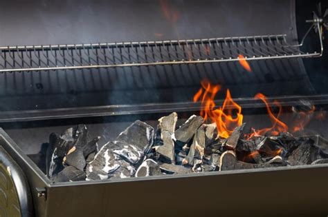 Premium Photo Barbecue Grill Pit With Glowing And Flaming Hot Open