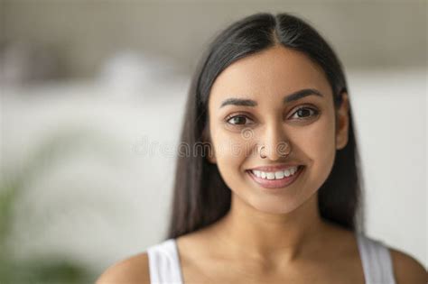 Portrait Of Happy Attractive Young Indian Lady Looking At Camera Stock