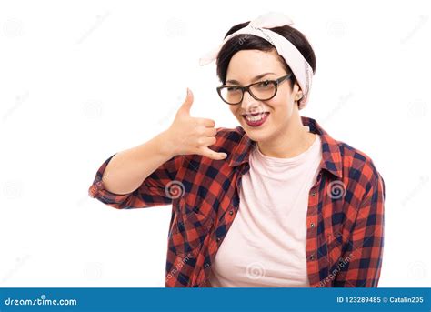 Young Pretty Pin Up Girl Wearing Glasses Showing Call Me Gesture Stock