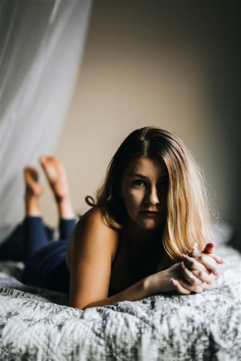 Woman In Black Tank Top Lying On Bed Photo Free Photo Image On Unsplash