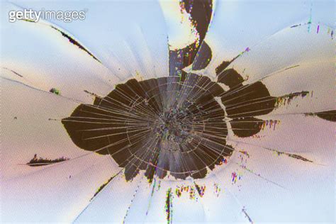 Close Up View Of Physically Damaged Lcd Screen Surface With Impact Spot Radial Cracks Pixel