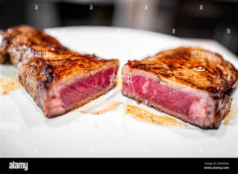 Macro Closeup Of Rare Red Grilled Cooked Grass Fed New York Strip Meat