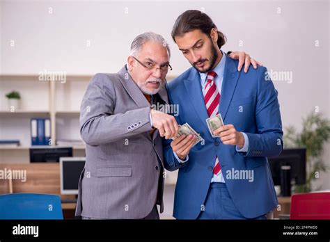 Two Employees In Remuneration Concept Stock Photo Alamy