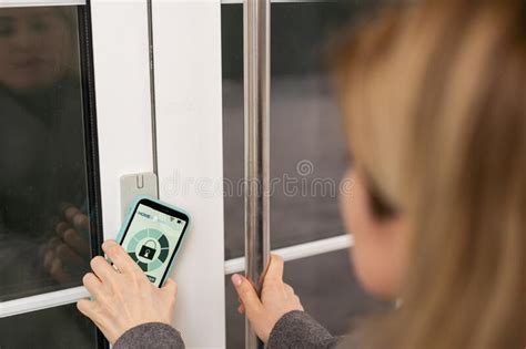 Woman Hands Using Phone Scan To Digital Door Lock Security Systems At