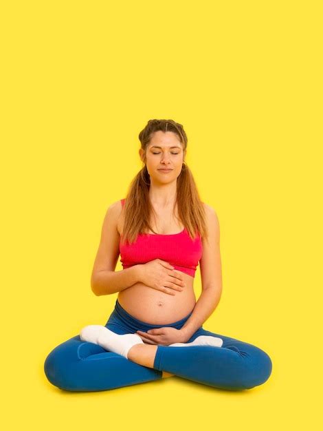 Premium Photo Young Pregnant Woman Meditating In Lotus Pose Yoga