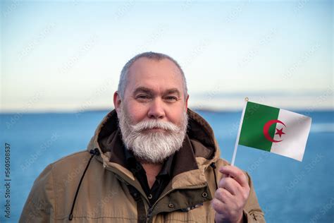 Man Holding Algeria Flag Portrait Of Older Man With A National