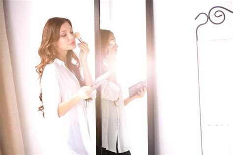 Premium Photo Young Woman Looking Herself Reflection In Mirror At