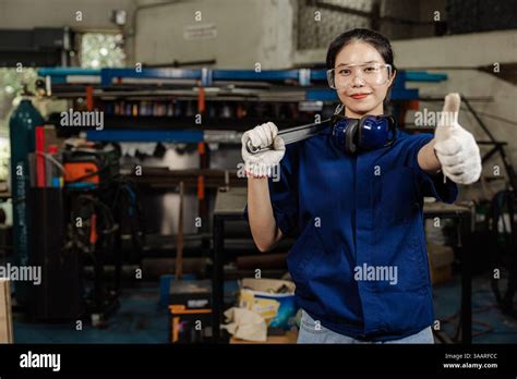 Portrait Engineer Women Working In Lathe Shop With Metal Machinery Lathe Milling Machine