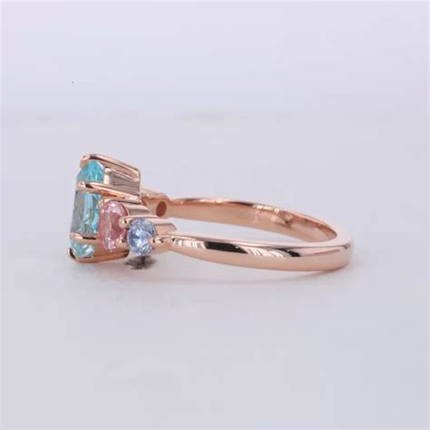 6×8mm Pear Cut Lab Grown Paraiba Sapphire With Side Moissanite 10k Rose