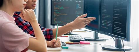 Premium Photo Female Programer Explain While Pointing Code Displayed