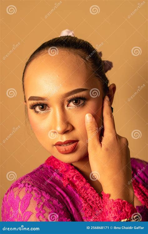 Asian Woman Wearing A Pink Dress Called Kebaya With A Hot Pose Stock